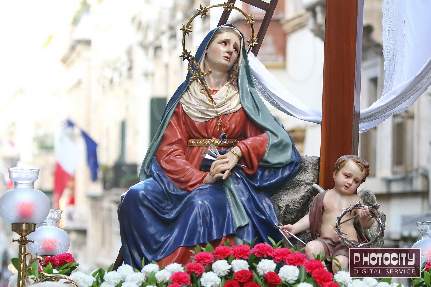 The Archbishop leads the procession of Our Lady of Sorrows ...